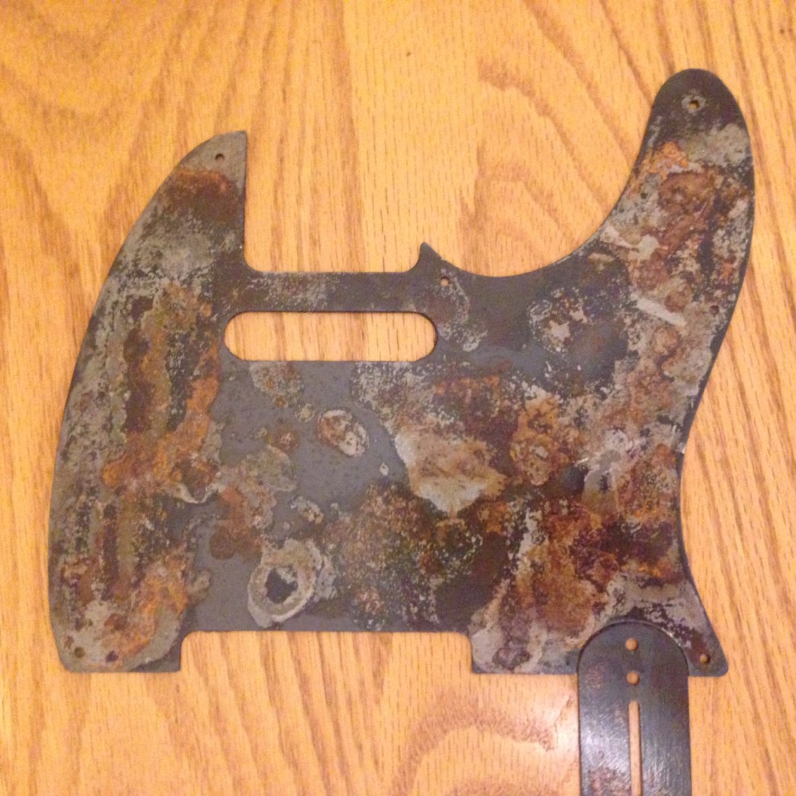 Guitar pickguards from rusted metal, handmade by Rusted Relics Music,